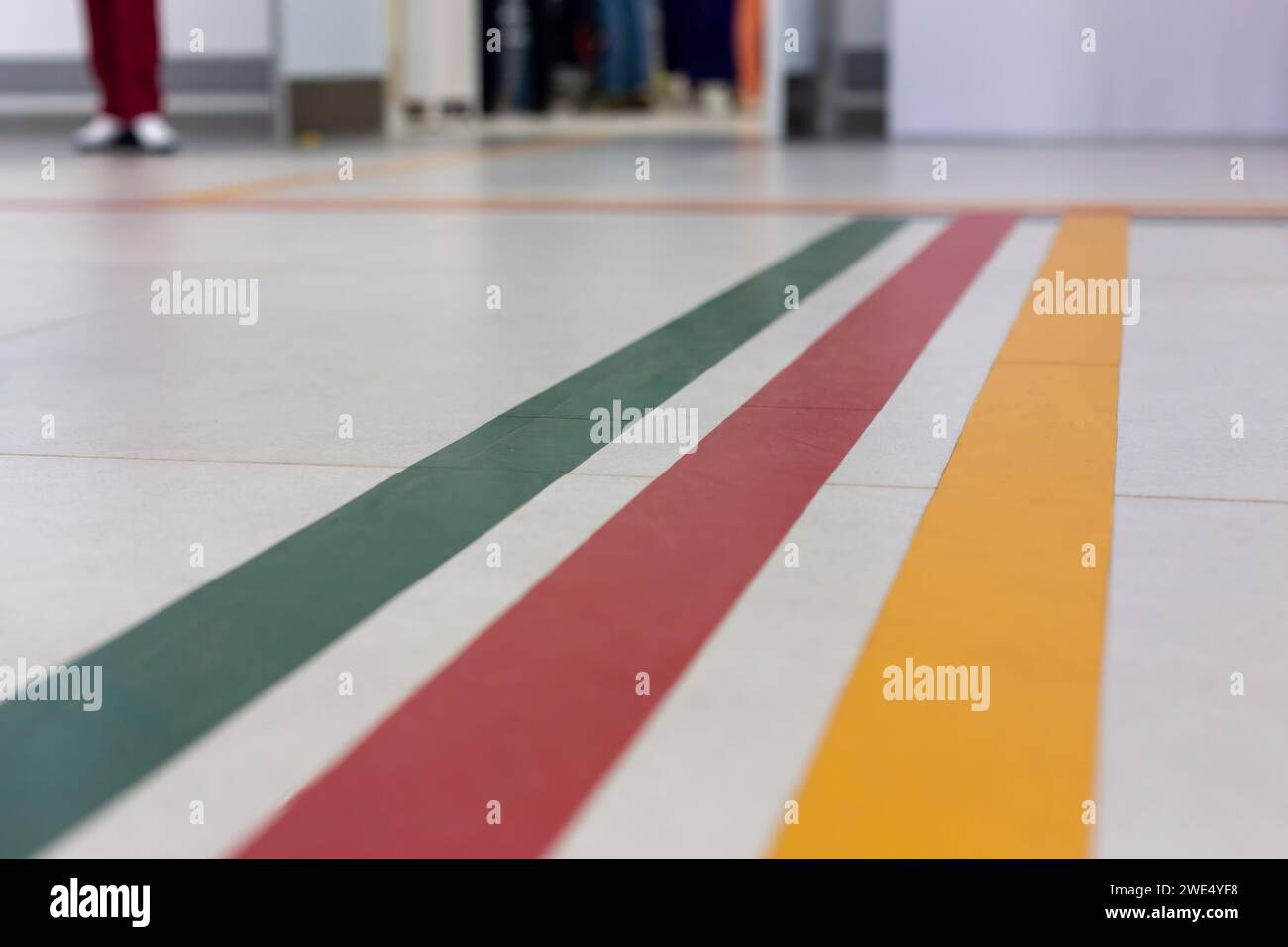 Colorful guidance lines on a hospital corridor floor for navigation ...
