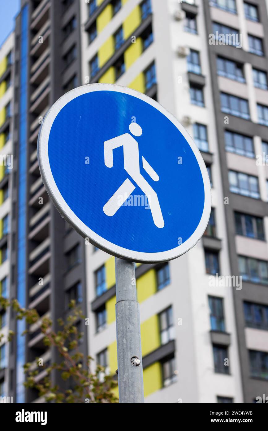 Pedestrian zone road sign on the background of a tall building Stock ...