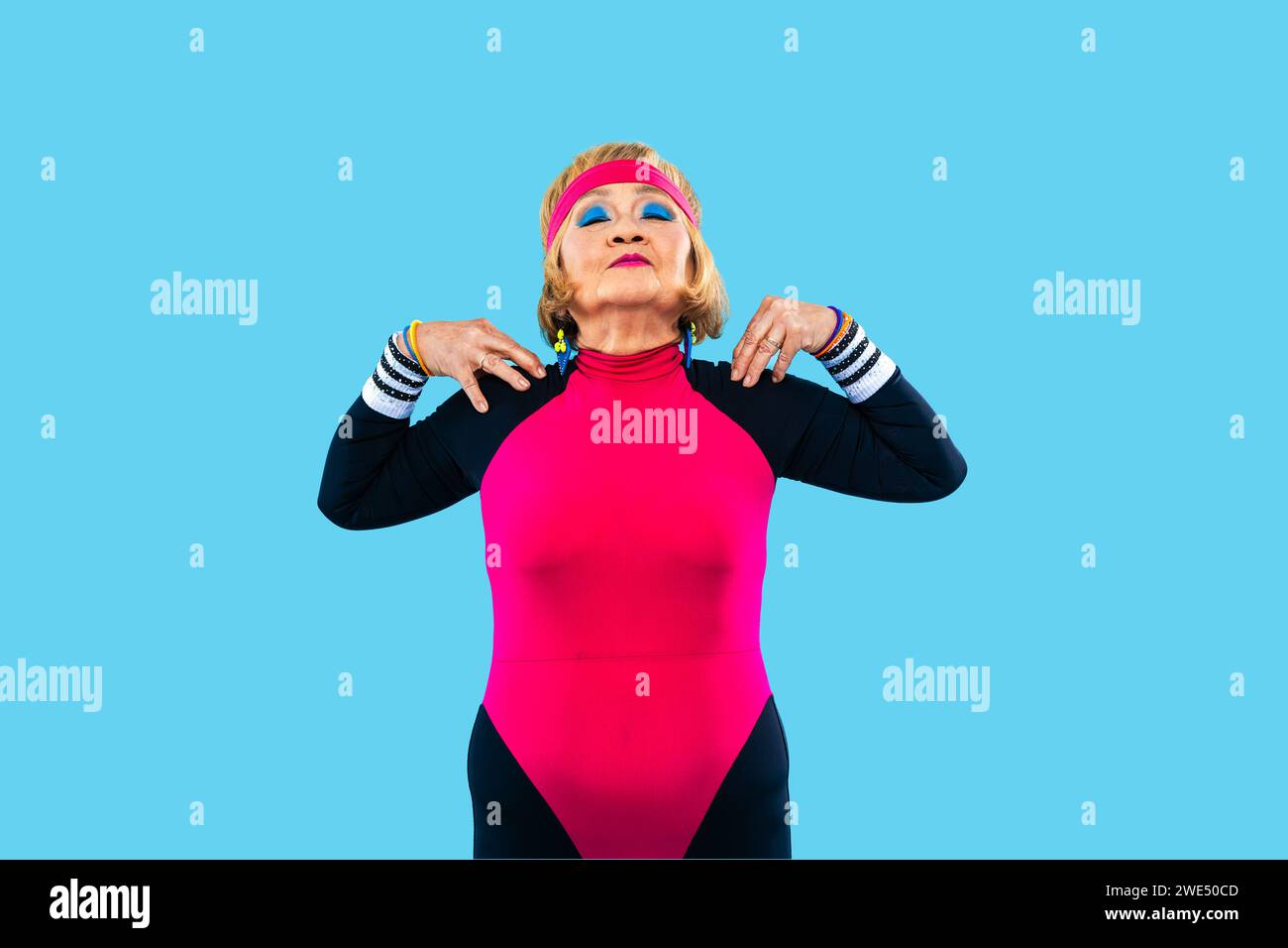 Happy and funny senior old woman wearing sportswear clothing on ...