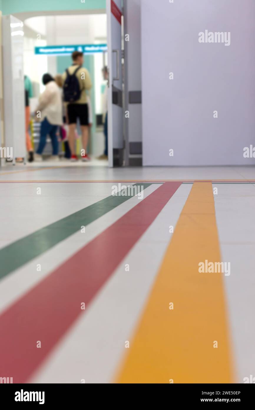 Colorful guidance lines on a hospital corridor floor for navigation ...