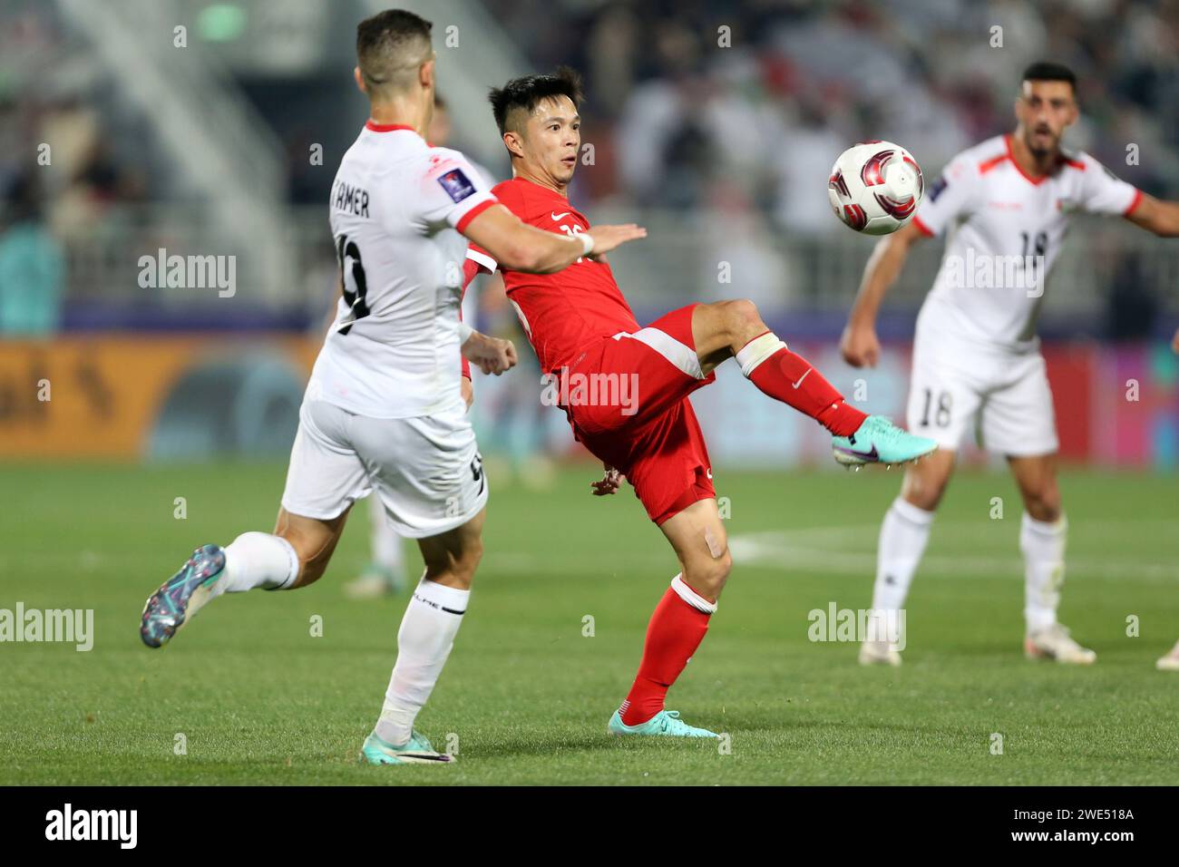 Hong Kong's Chan Siu Kwan Philip, right, fights for the ball against ...