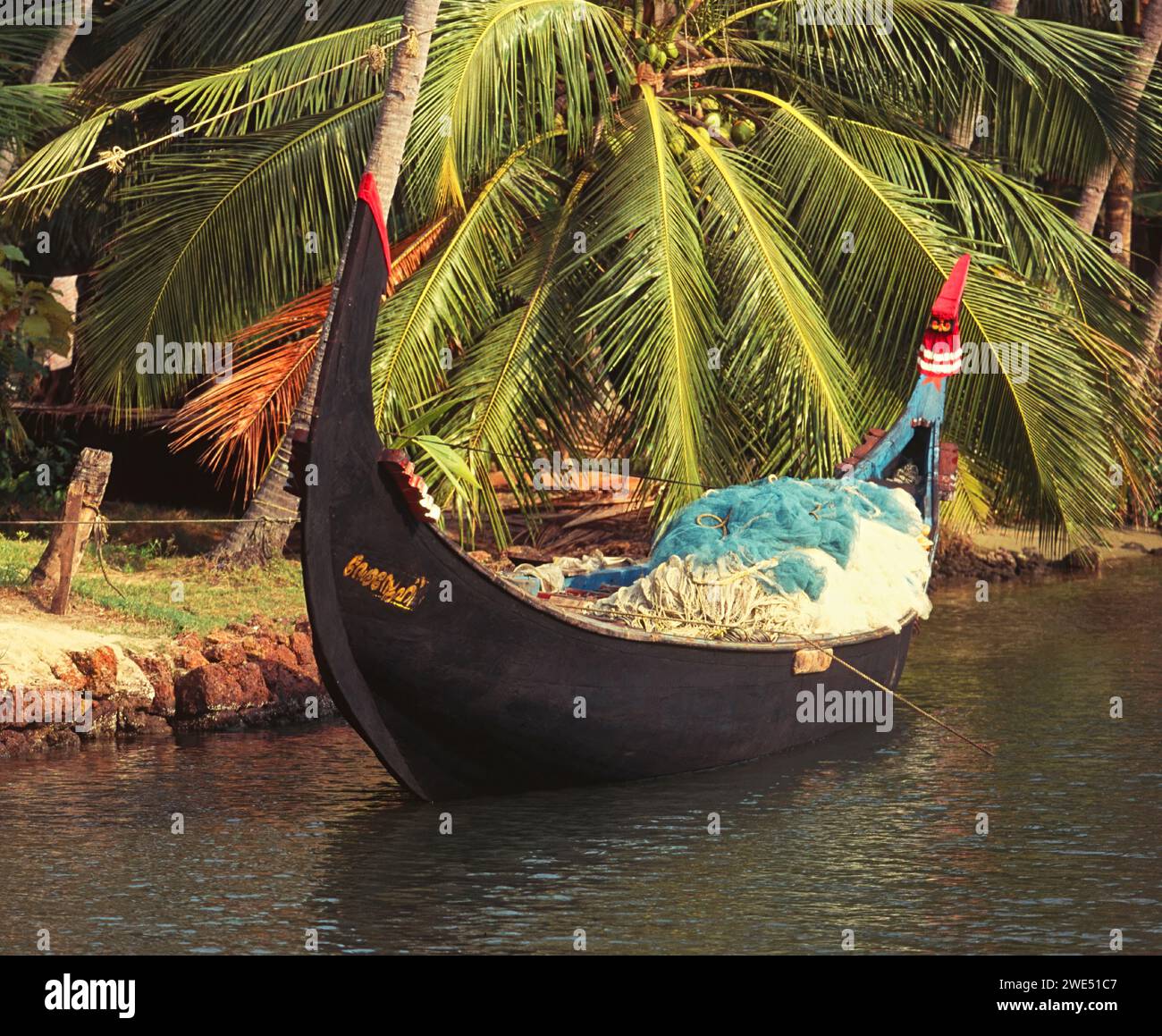 Traditional fishing boat on a backwater canal Kerala India Stock Photo ...