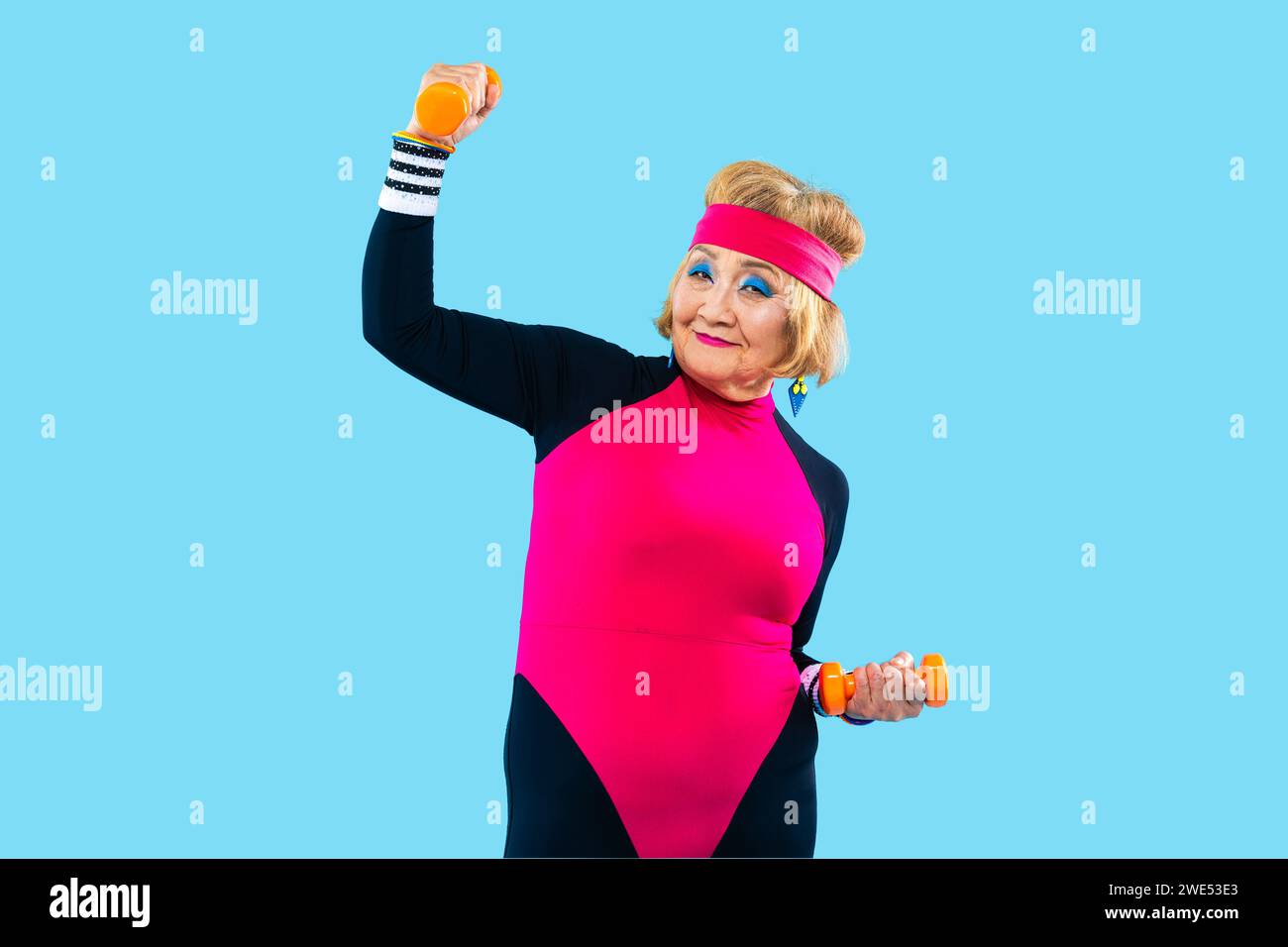 Happy and funny senior old woman wearing sportswear clothing on ...