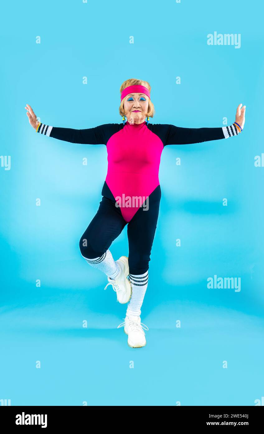 Happy and funny senior old woman wearing sportswear clothing on ...