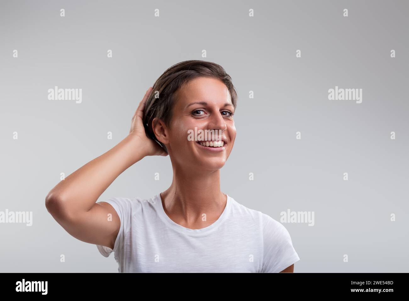 The woman's bright smile and sparkling eyes reflect an aura of ...