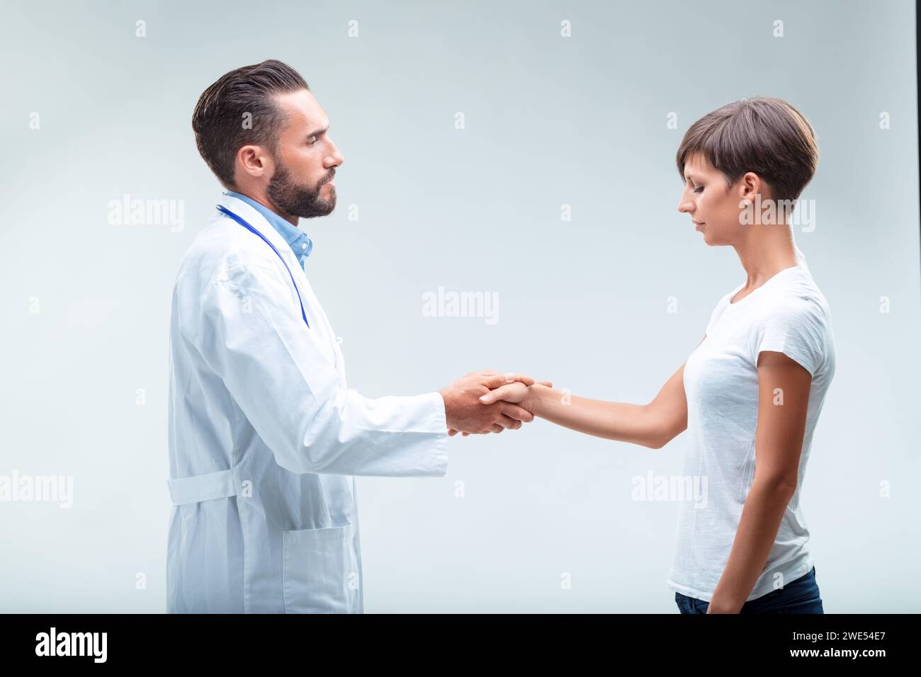 Critical care moment, where a doctor's supportive hand conveys strength ...