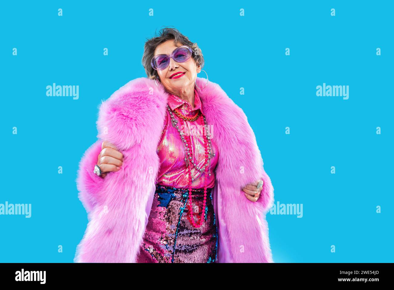 Happy and funny senior old woman wearing fashinable clothing on ...