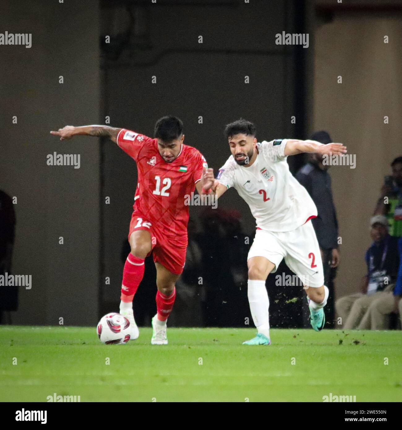 Al Rayyan, Qatar. 14th Jan, 2024. Camilo Saldana of Palestine and Sadegh Moharrami of Iran ...