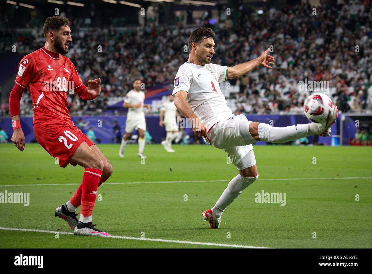 Al Rayyan, Qatar. 14th Jan, 2024. Shojae Khalilzadeh of Iran and Zaid ...