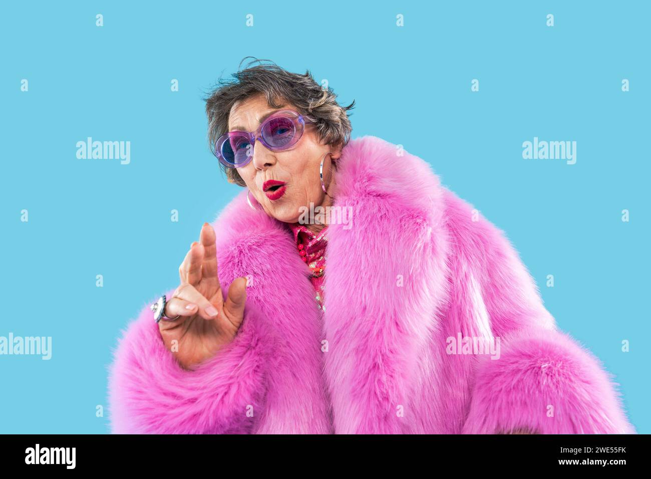 Happy and funny senior old woman wearing fashinable clothing on ...