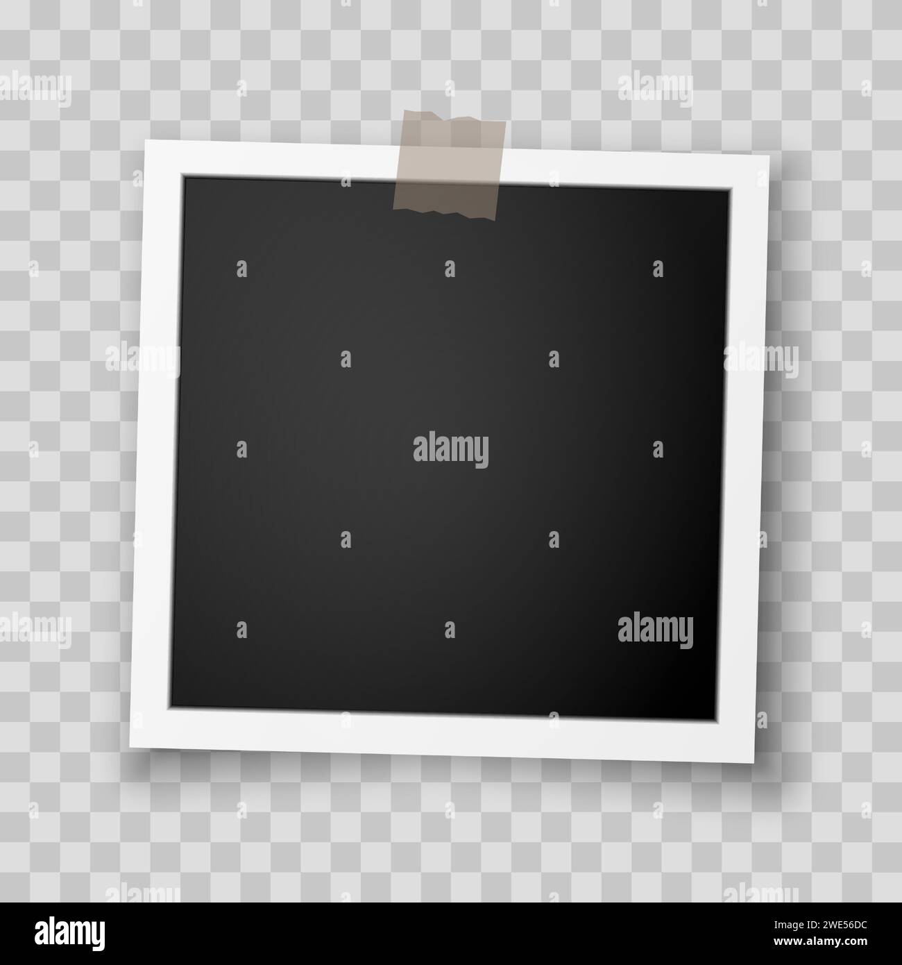 Retro photo frames with white margins and adhesive tape on a ...