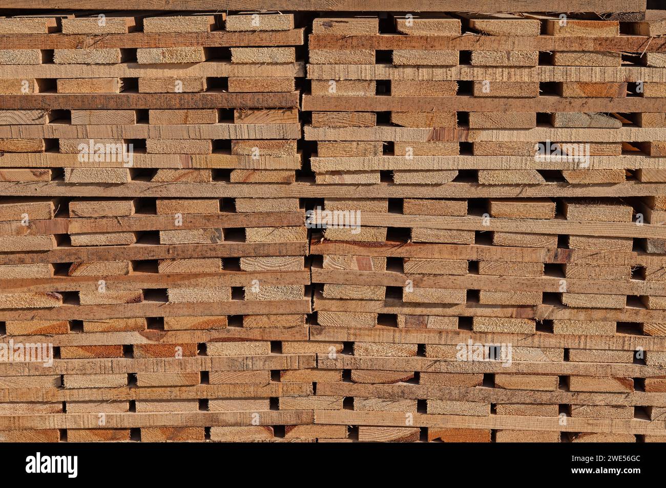 Treated timber packed in blocks. Wooden timber in the sawmill. Stacked ...