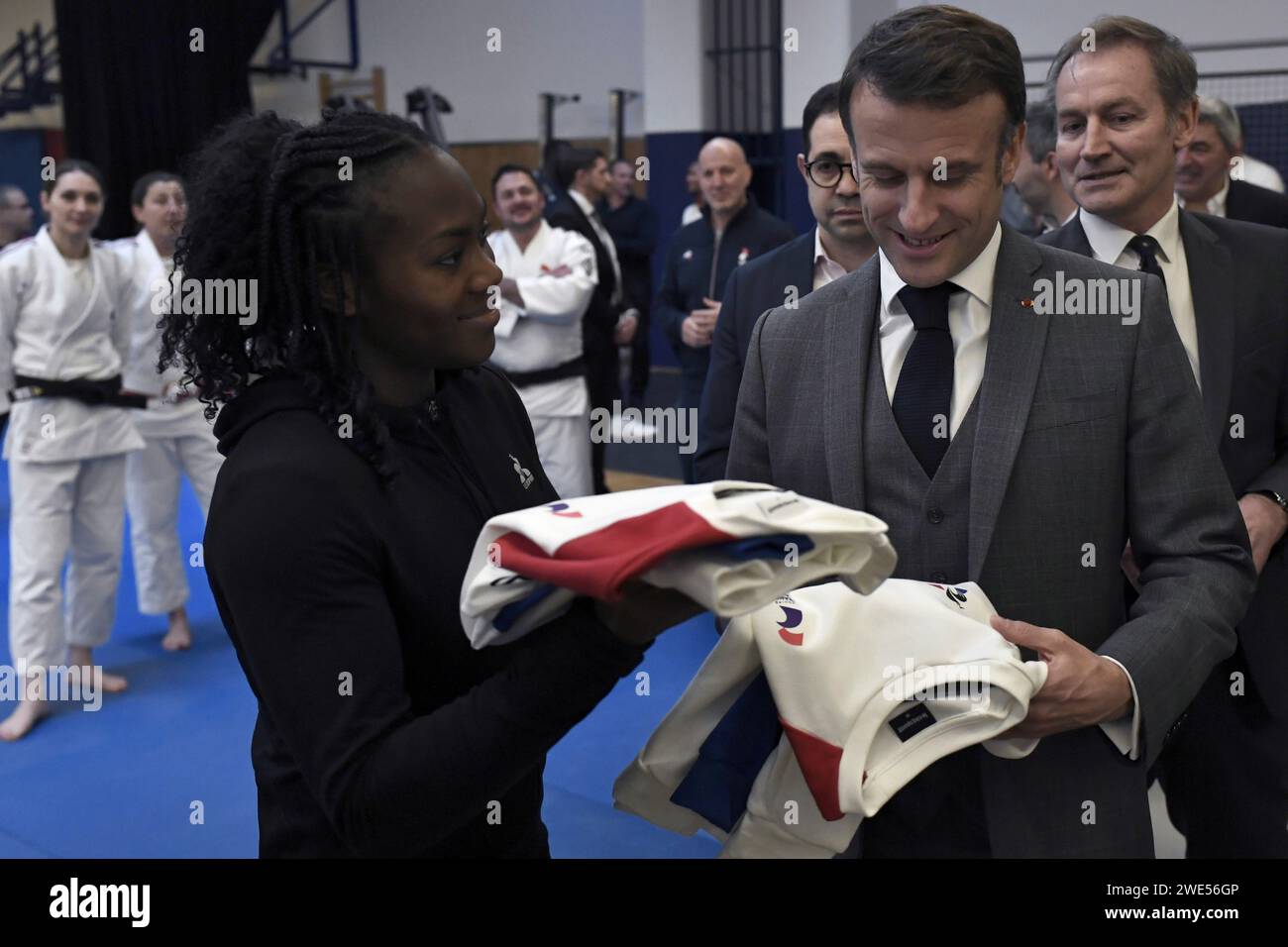 French President Emmanuel Macron, foreground right, receives official ...