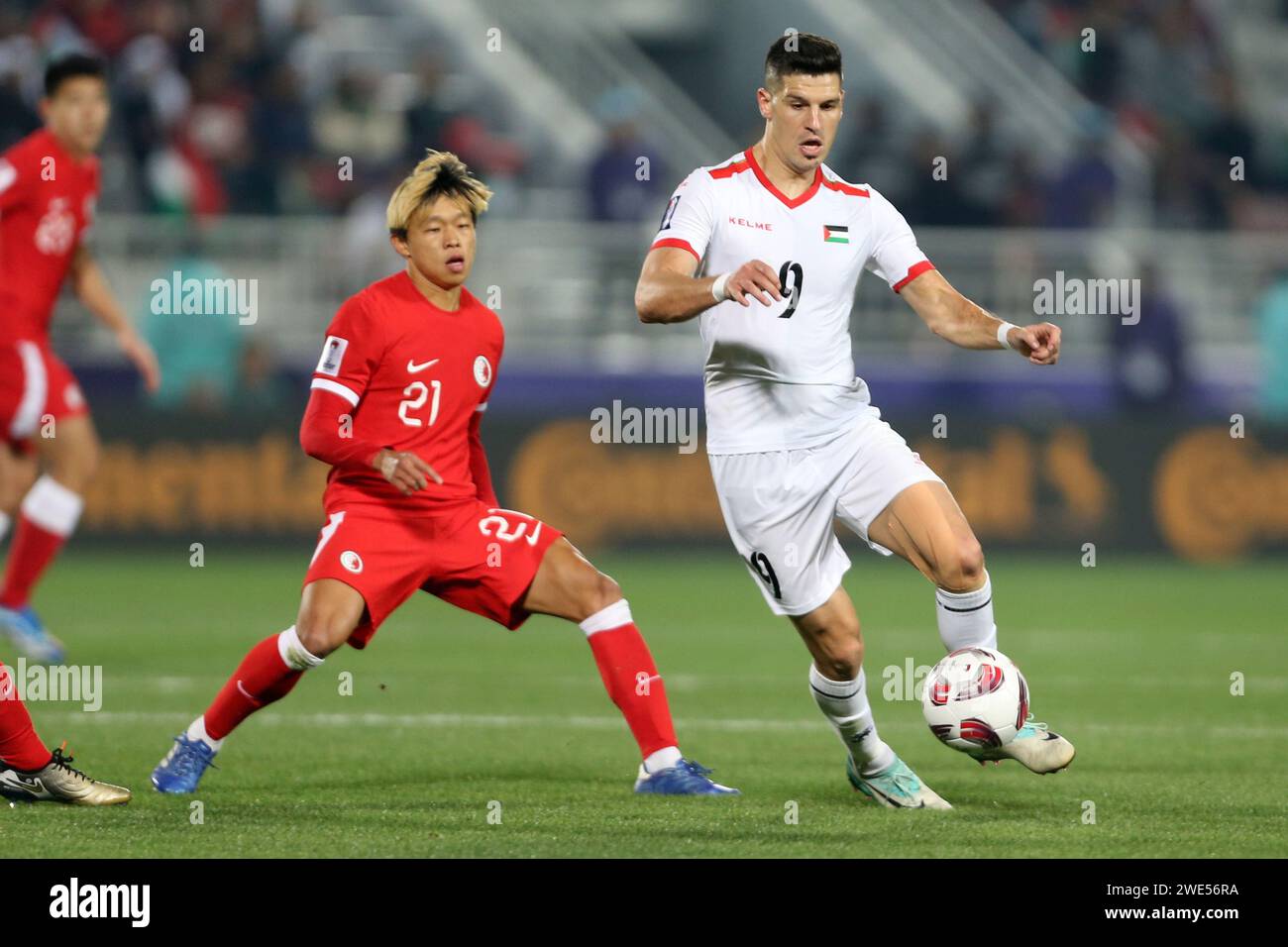 Palestine's Tamer Seyam, right, fights for the ball with Hong Kong's ...