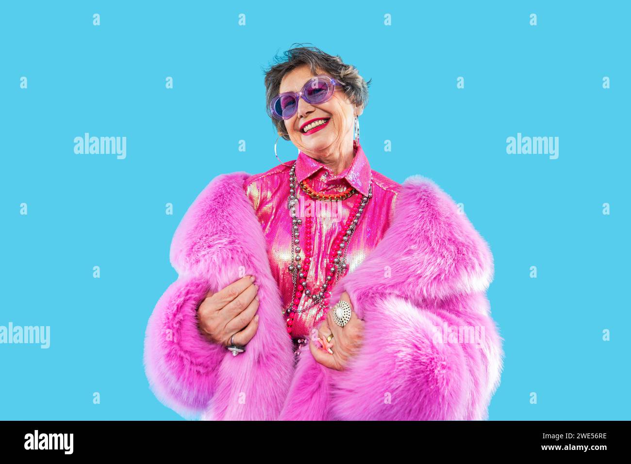 Happy and funny senior old woman wearing fashinable clothing on ...