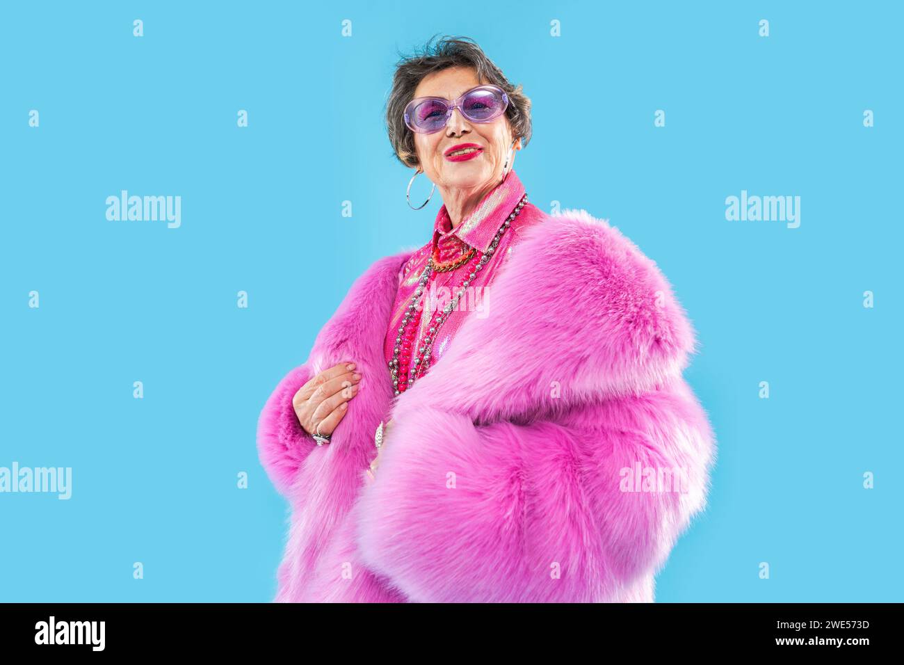 Happy and funny senior old woman wearing fashinable clothing on ...
