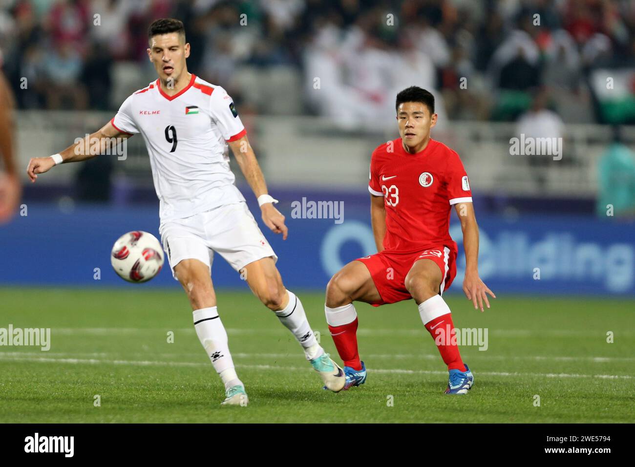 Palestine's Tamer Seyam, left, controls the ball as Hong Kong's Sun ...