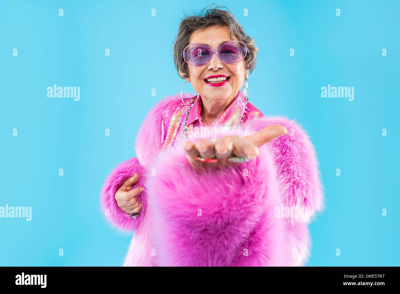 Happy and funny senior old woman wearing fashinable clothing on ...