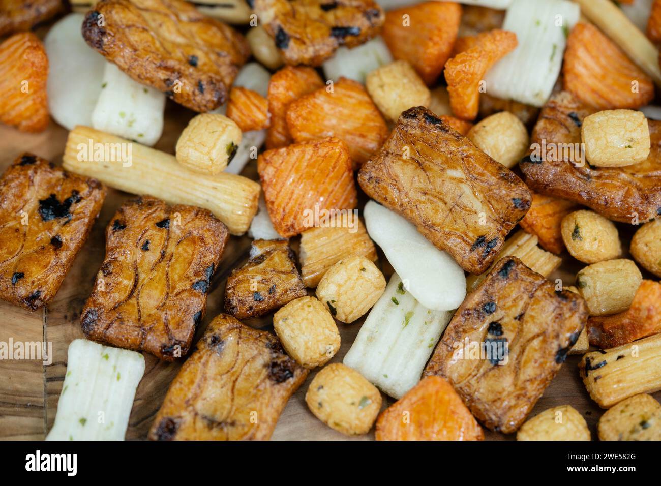 Different types of Japanese rice cakes on olive wood Stock Photo - Alamy