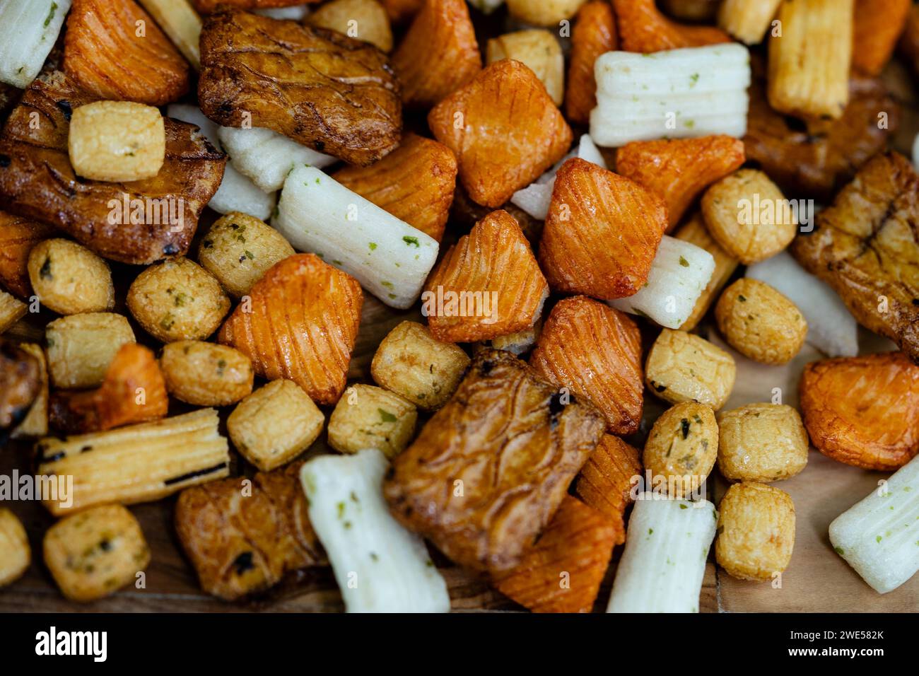 Different types of Japanese rice cakes on olive wood Stock Photo - Alamy