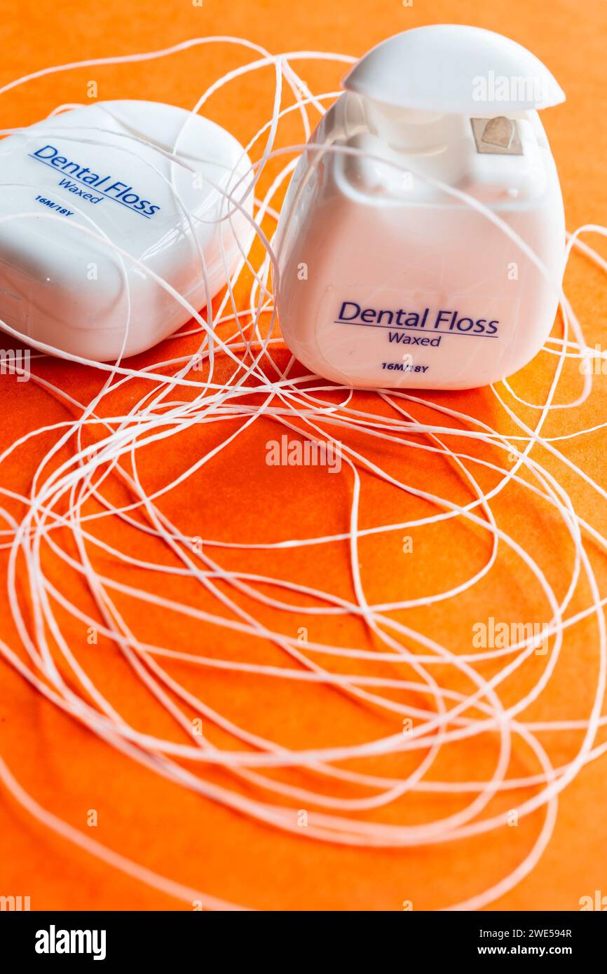 Dental Floss Container with dispensed floss, USA Stock Photo - Alamy