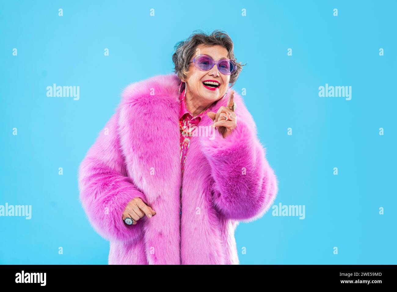 Happy and funny senior old woman wearing fashinable clothing on ...