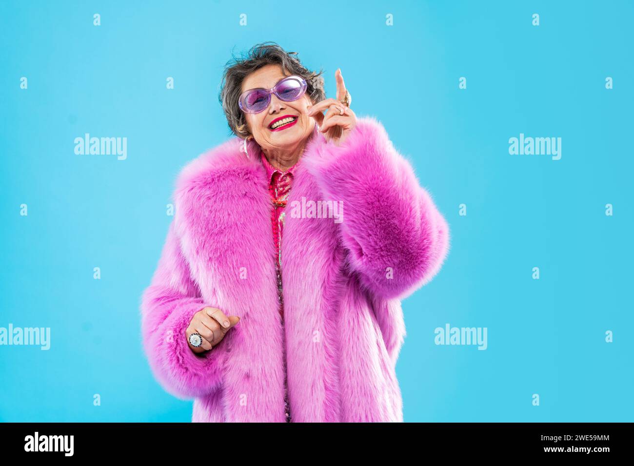 Happy and funny senior old woman wearing fashinable clothing on ...