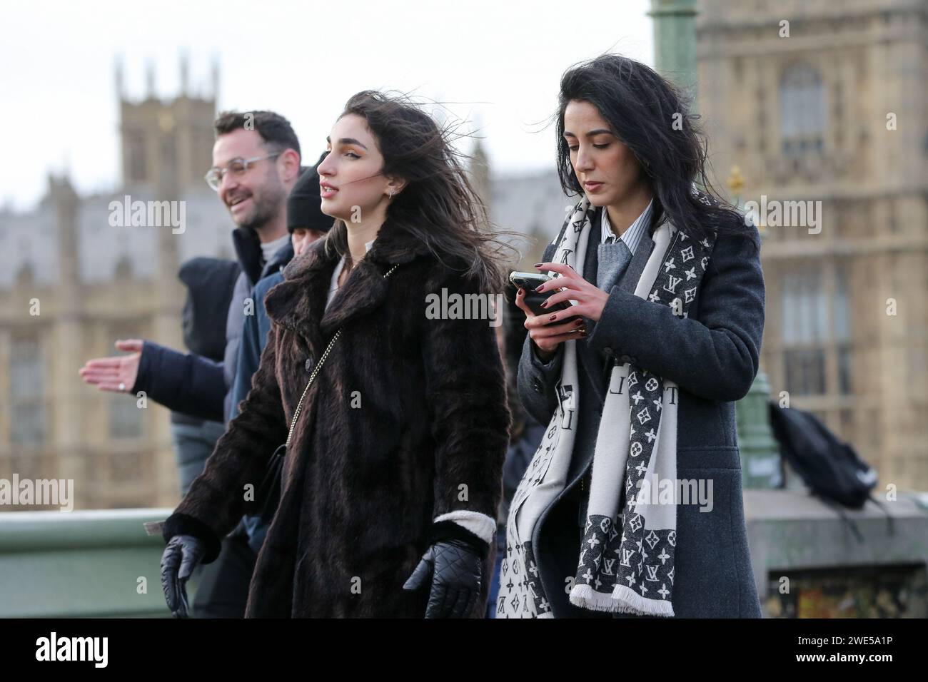 London, UK. 21st Jan, 2024. A woman seen using her mobile phone in ...