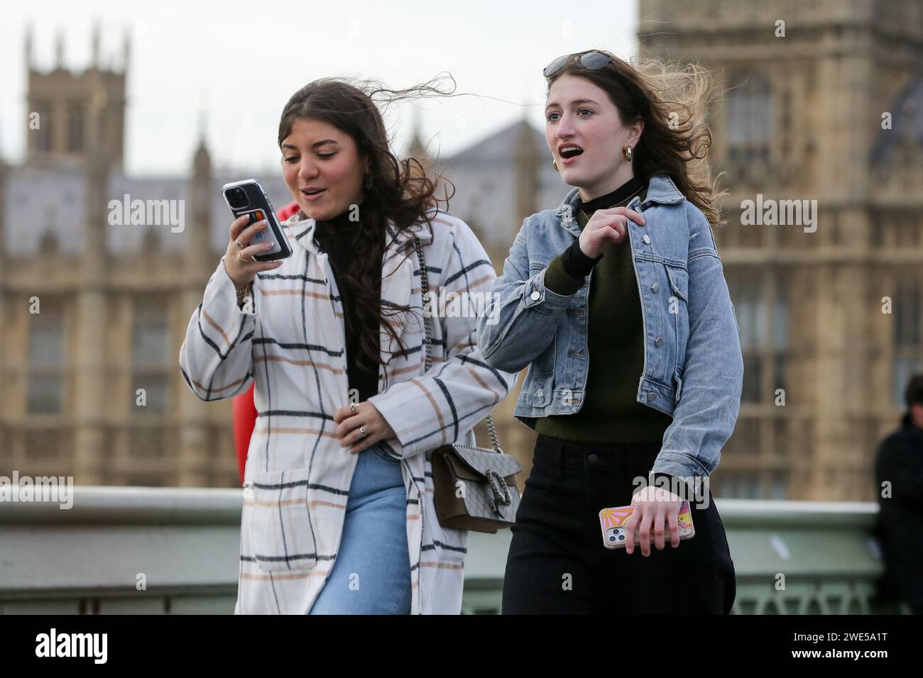 London, UK. 21st Jan, 2024. A woman seen using her mobile phone in ...