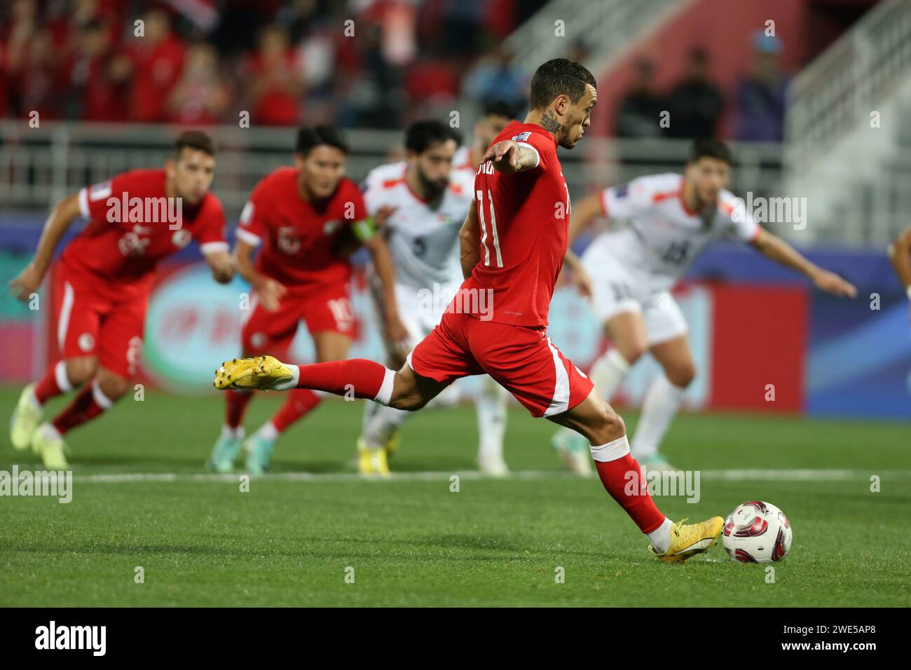 Hong Kong's Everton Camargo takes a penalty kick and misses it during ...