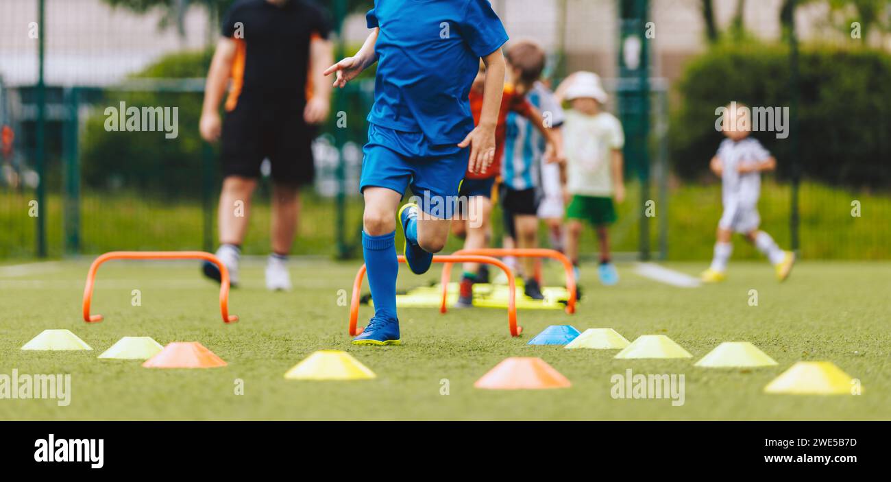 Group of children on physical education training with coach. Sport ...