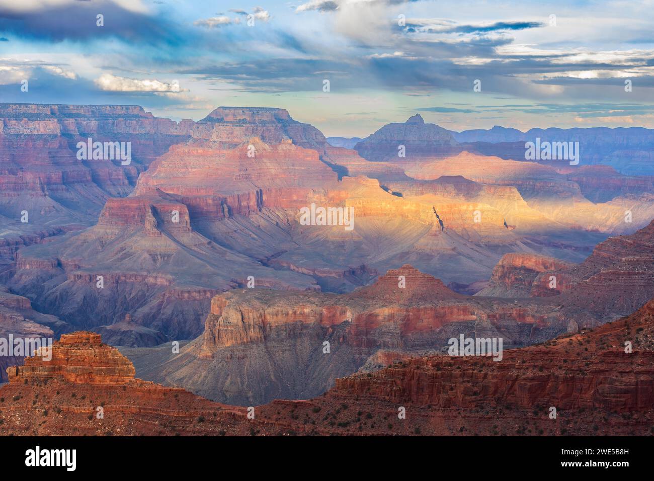 The last ray of sun broke through the clouds at sunset and illuminated ...