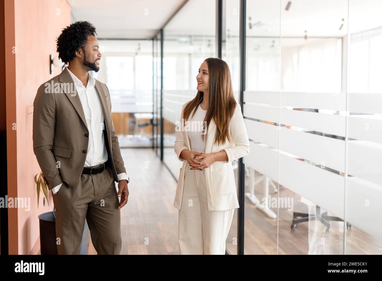 A moment of professional engagement is captured as a businessman and ...