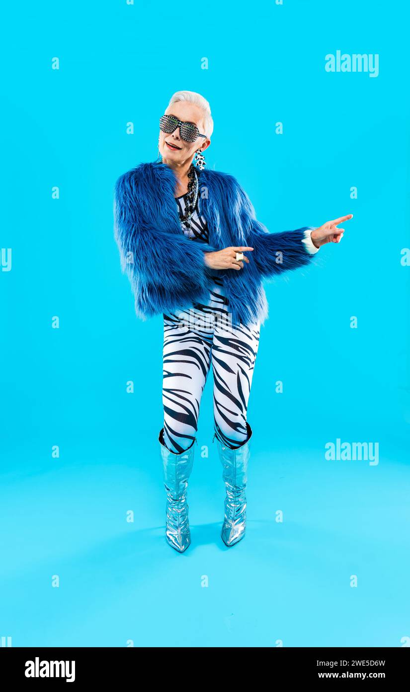 Happy and funny senior old woman wearing fashinable clothing on ...