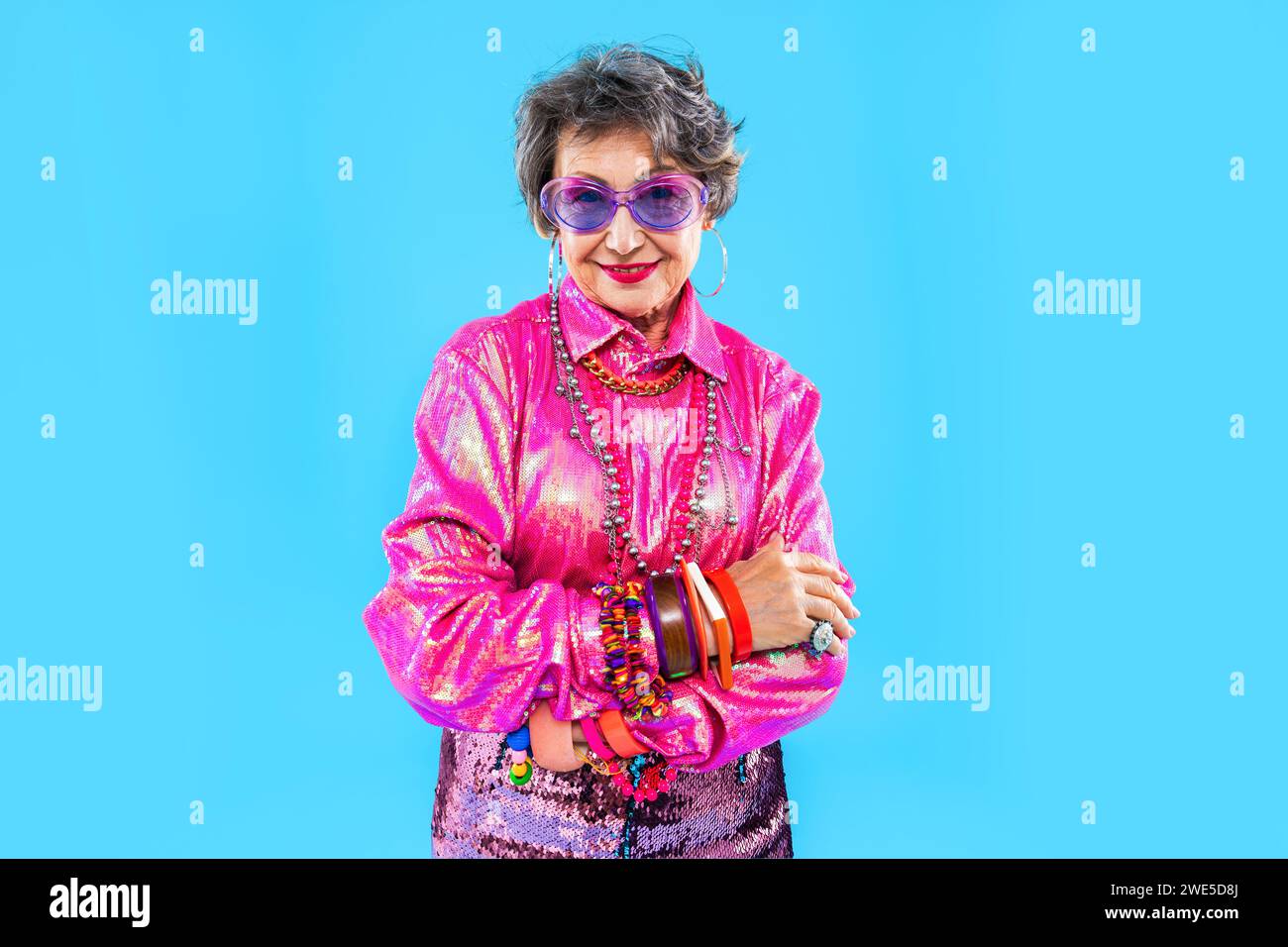 Happy and funny senior old woman wearing fashinable clothing on ...