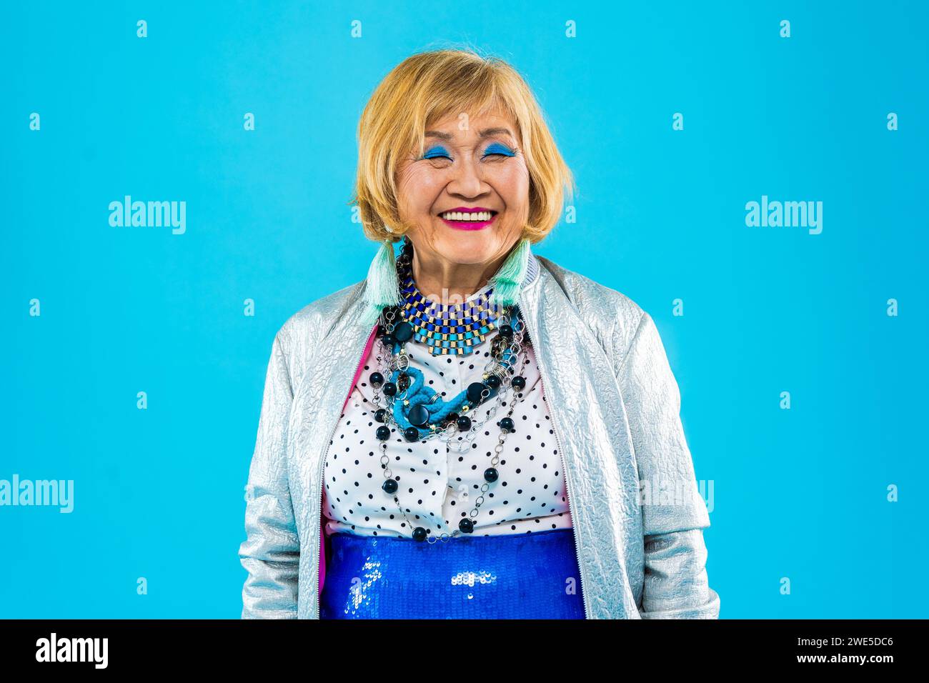 Happy and funny senior old woman wearing fashinable clothing on ...