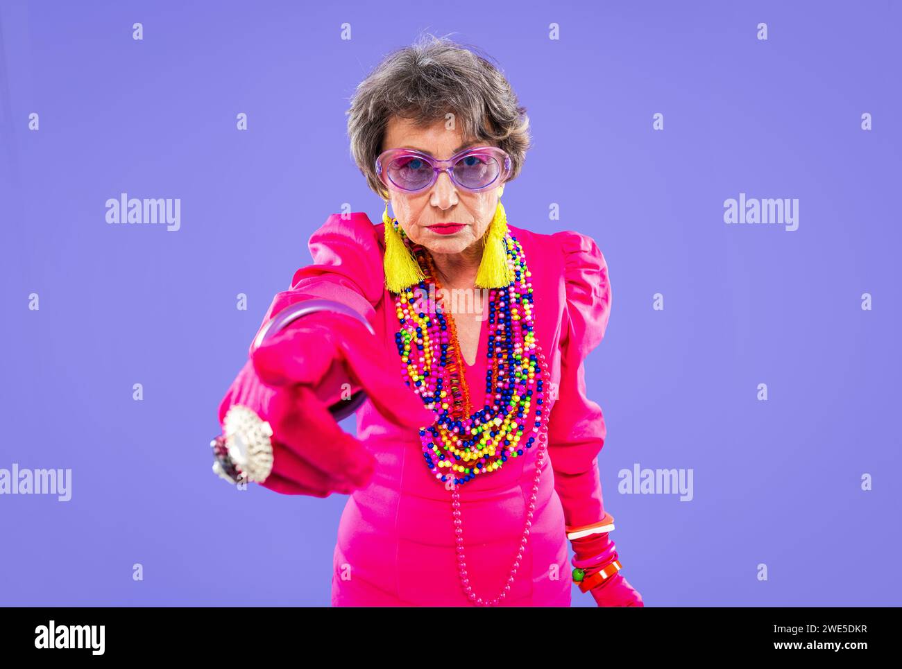 Happy and funny senior old woman wearing fashinable clothing on ...