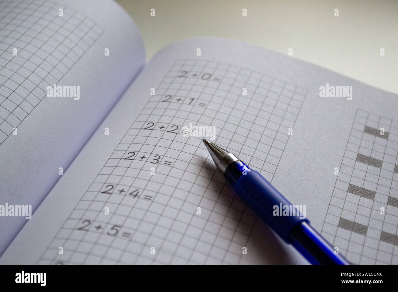 learning to count and write numbers correctly, notebook and pencils ...