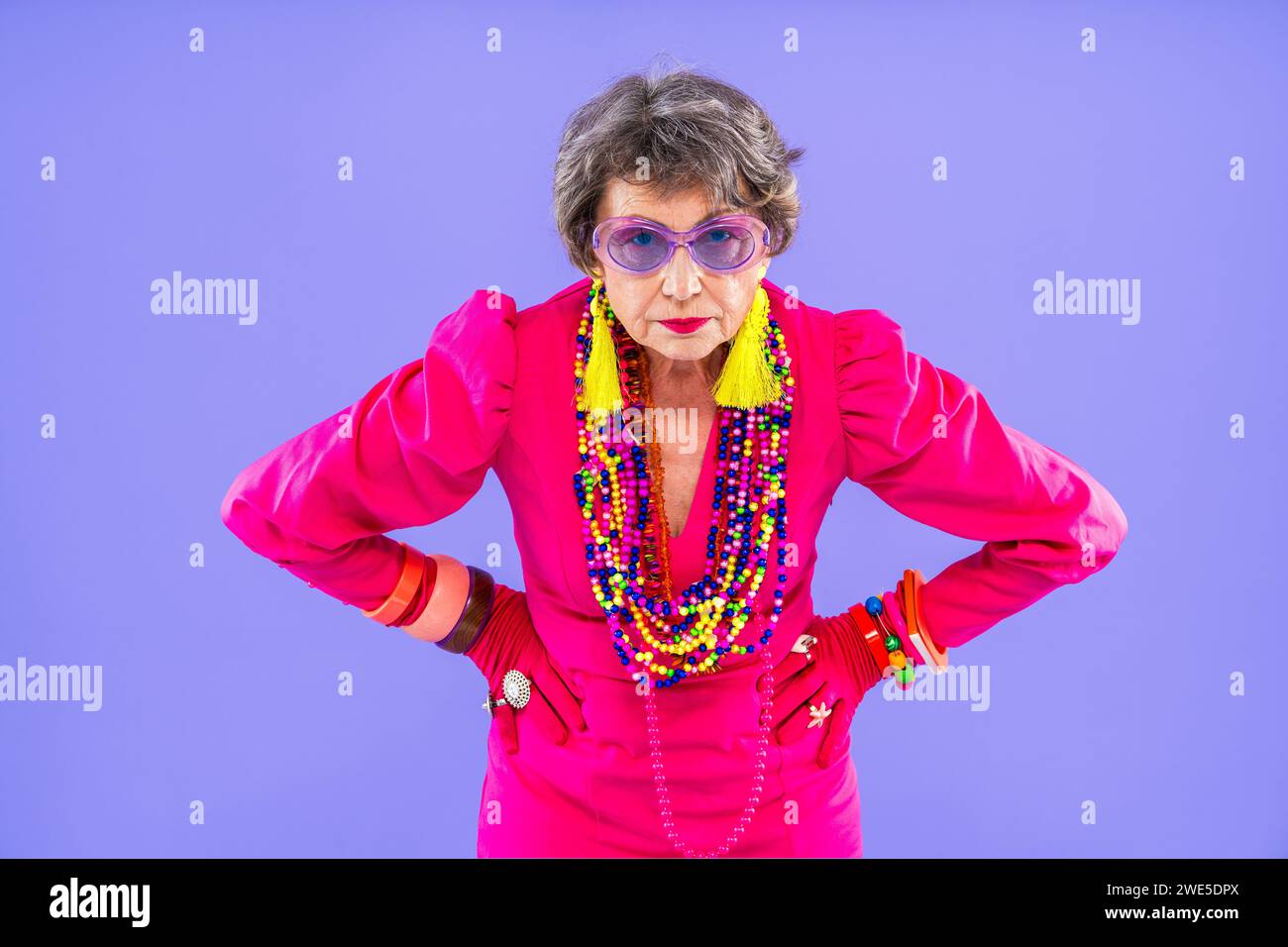Happy and funny senior old woman wearing fashinable clothing on ...