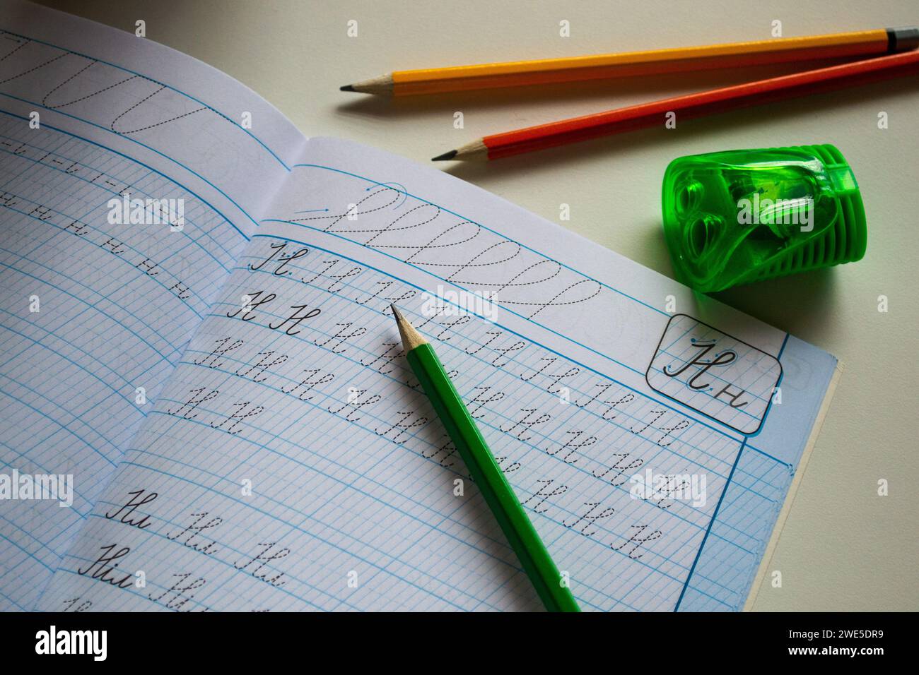 Back to school, learning to write letters correctly, notebook and ...