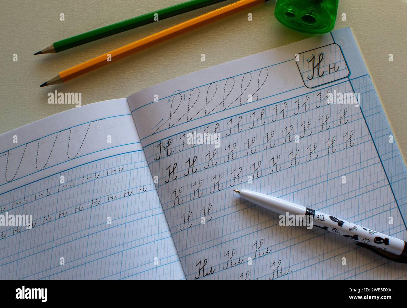 Back to school, learning to write letters correctly, notebook and ...