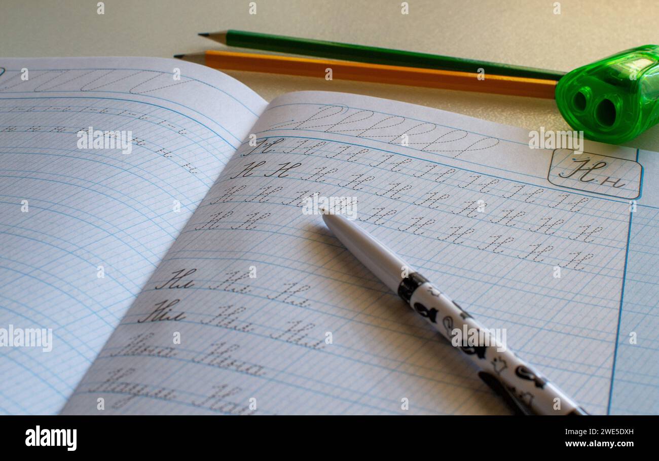 Back to school, learning to write letters correctly, notebook and ...