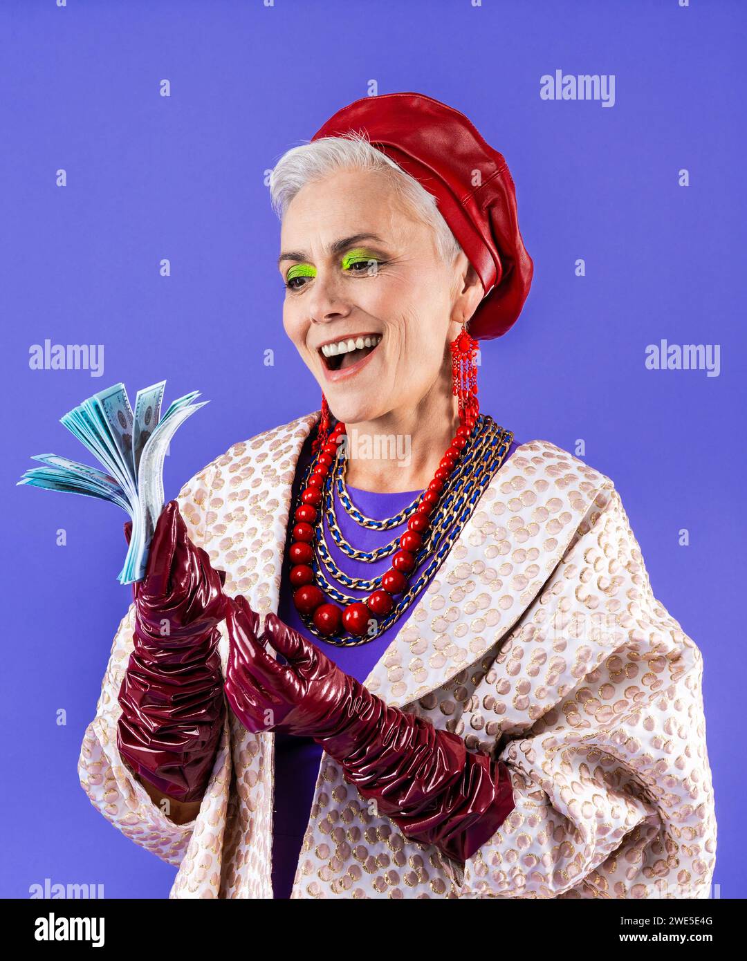 Happy and funny senior old woman wearing fashinable clothing on ...
