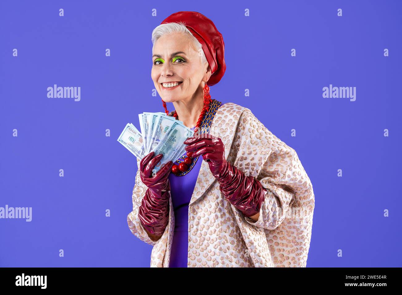 Happy and funny senior old woman wearing fashinable clothing on ...