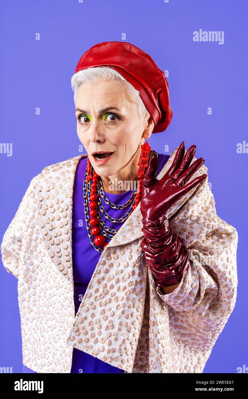 Happy and funny senior old woman wearing fashinable clothing on ...