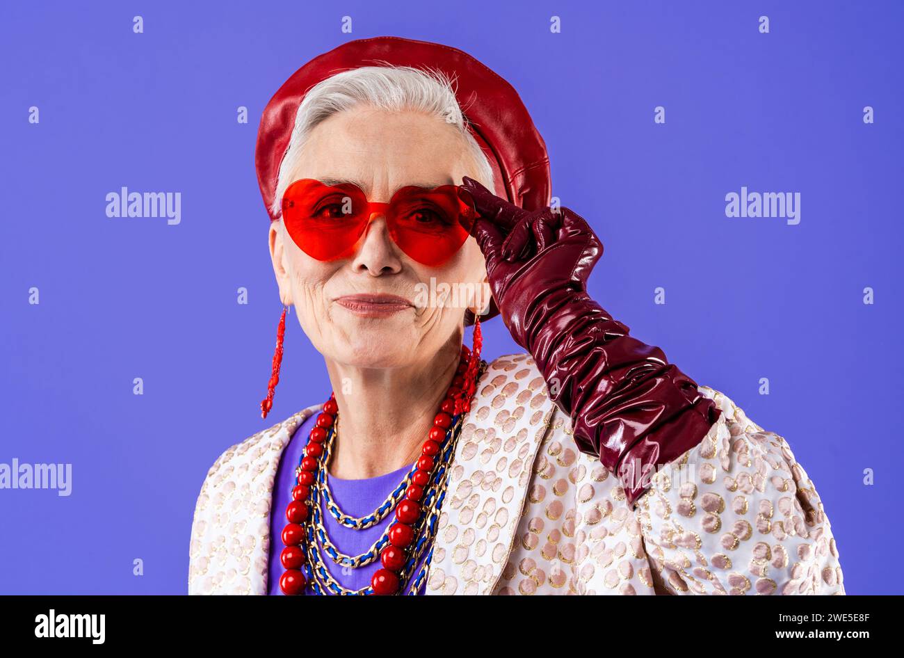 Happy and funny senior old woman wearing fashinable clothing on ...