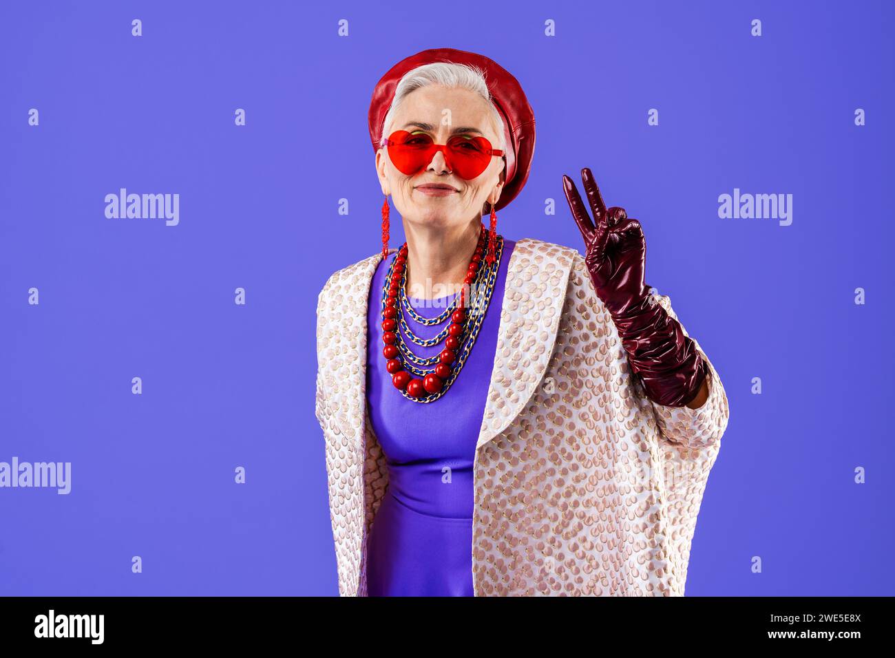 Happy and funny senior old woman wearing fashinable clothing on ...