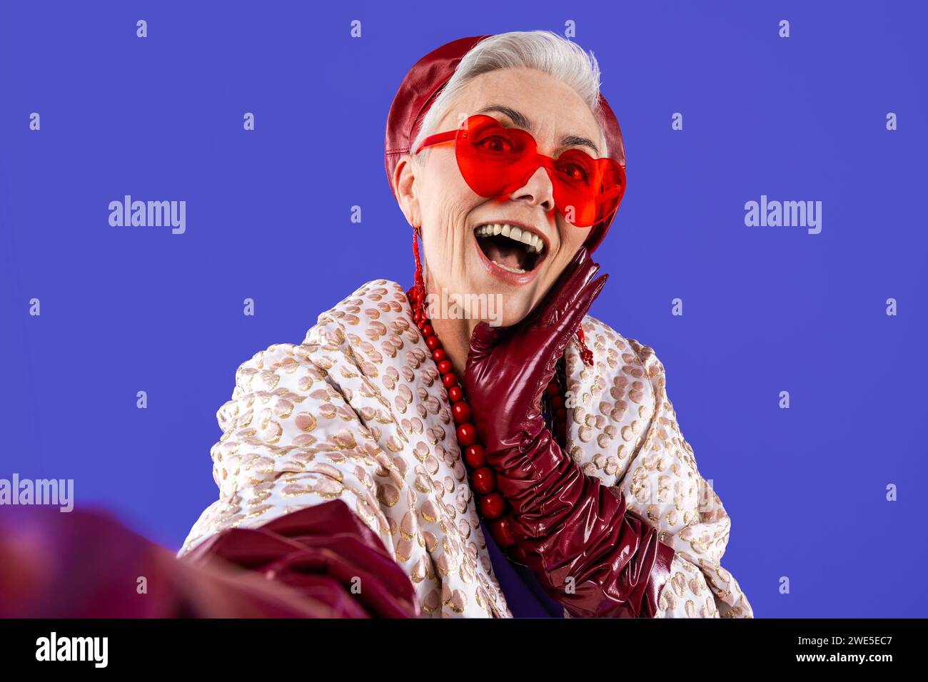 Happy and funny senior old woman wearing fashinable clothing on ...
