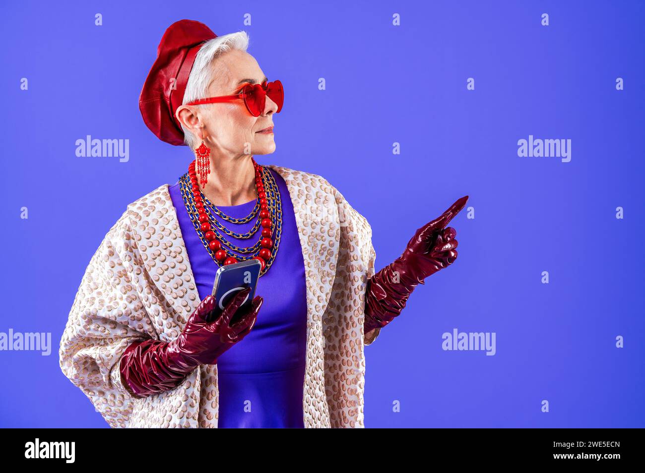 Happy and funny senior old woman wearing fashinable clothing on ...
