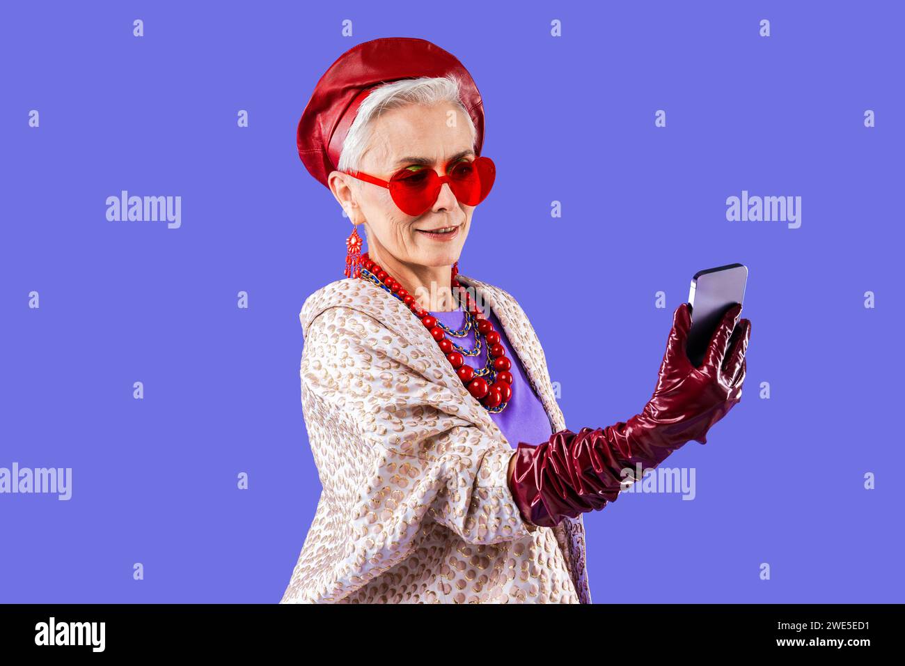 Happy and funny senior old woman wearing fashinable clothing on ...